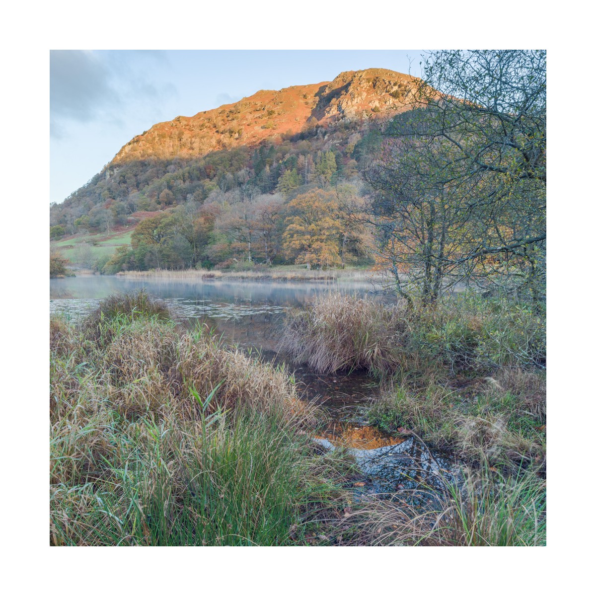 A beautiful calm morning over Rydal Water and Nab Scar in the Lake District